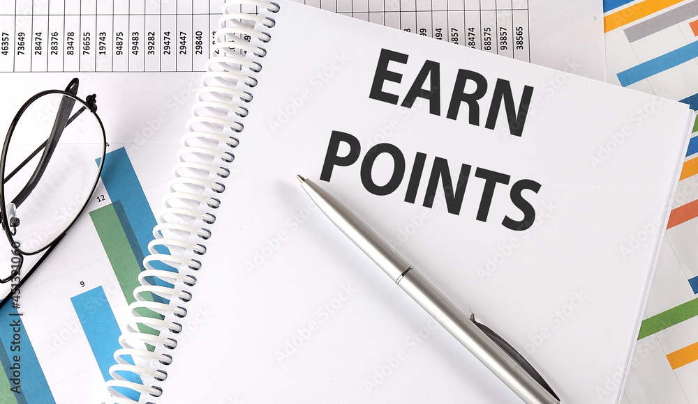 EARN POINTS text , pen and glasses on the chart,business Stock Photo ...