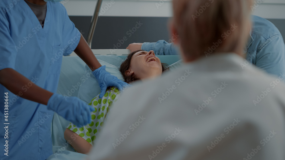 Woman in labor pushing for painful child delivery while husband ...