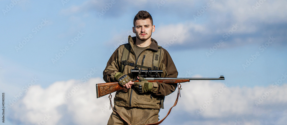 Hunter with hunting gun and hunting form to hunt sky background. Hunter ...