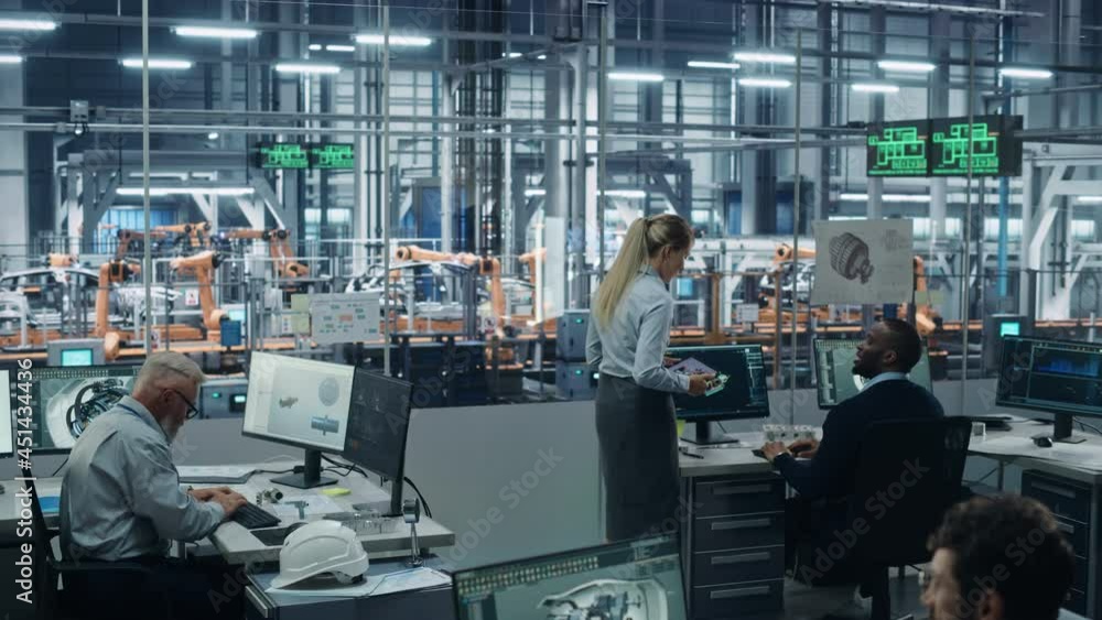 Car Factory: Team of Automotive Engineers Working, Using Computers to Design Advanced 3D Models ...
