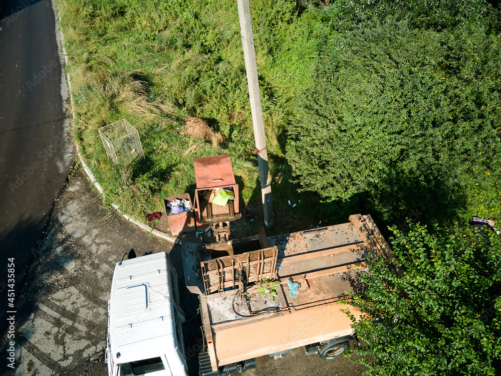 Municipal waste disposal. With a special car garbage truck, the garbage ...