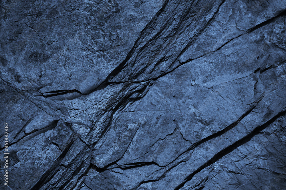 Blue rock texture. Close-up. Toned stone background with copy space for ...