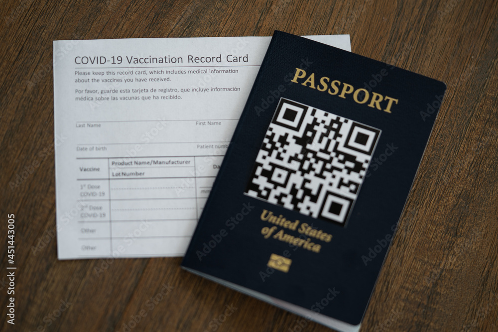 COVID-19 Vaccination record card next to the QR code Passport of USA ...