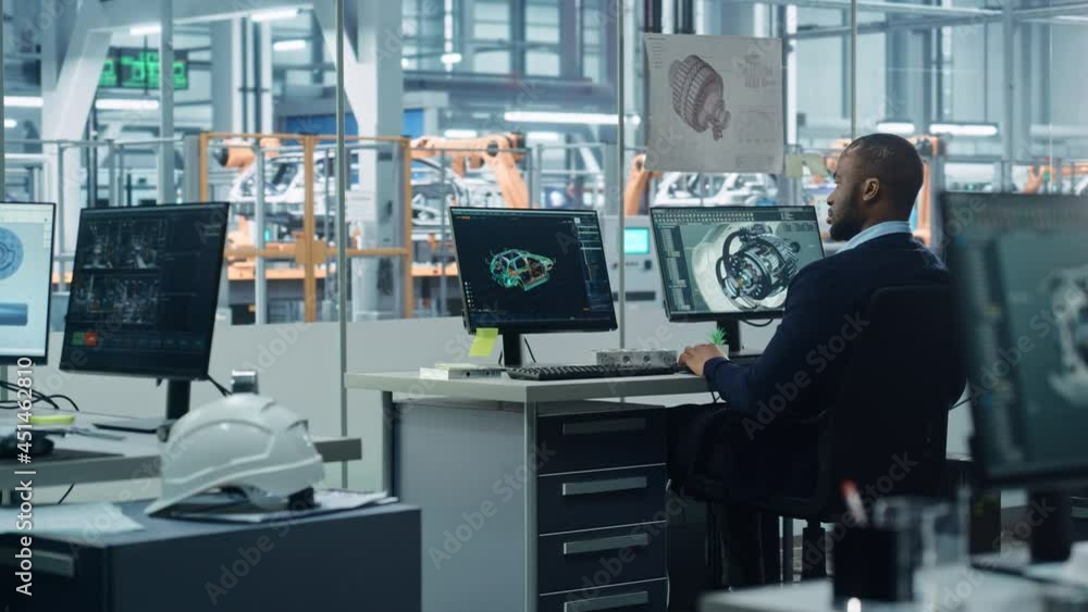 Car Factory Office: Black Engineer Working on Desktop Computer, Screens ...