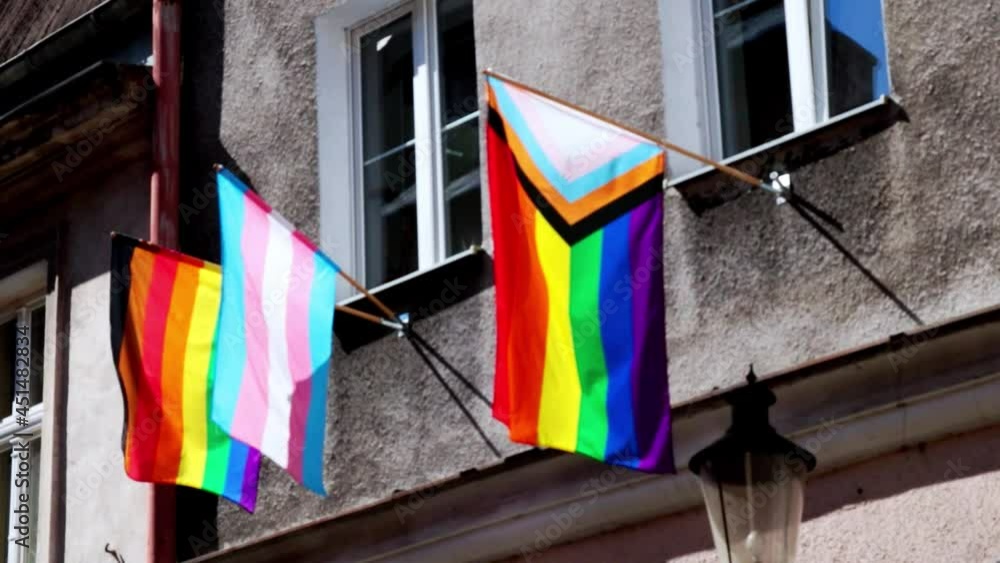 Multi-colored lgbt flag on the building of the house. LGBT gay pride ...