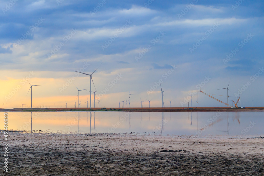 Building and assembling a construction wind turbines farm by a crane ...
