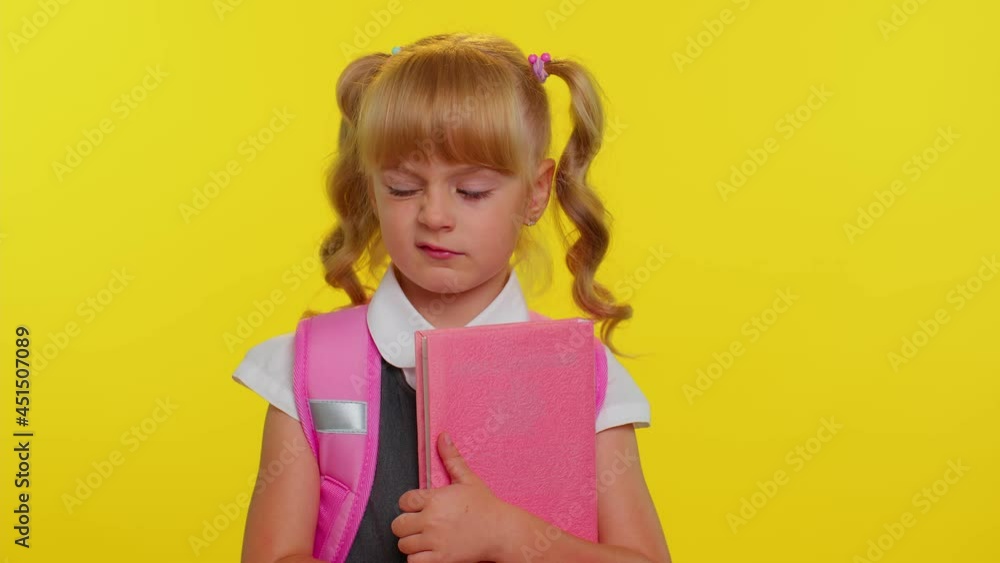 Funny smiling little girl kid in school uniform, making humorous face ...
