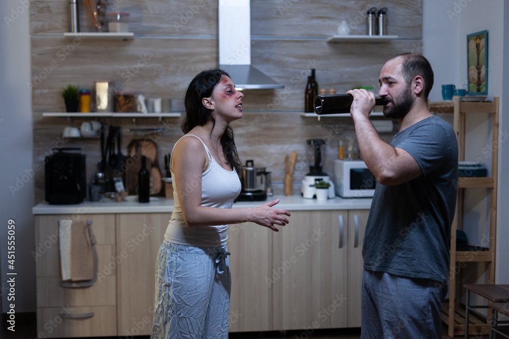 Couple fighting over alcohol addiction and aggression. Abused woman ...