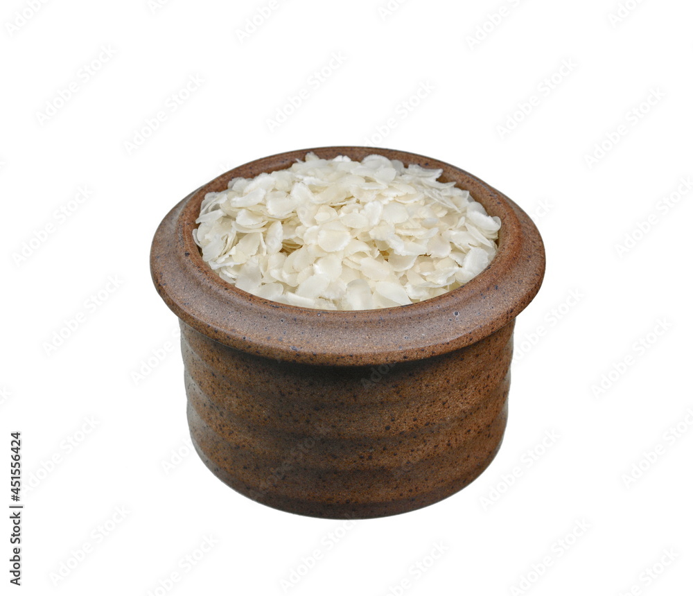 flattened rice flakes in a ceramic bowl isolated on white. Stock Photo ...