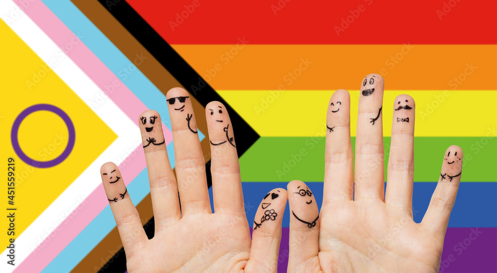 lgbtq, trans and intersex rights concept - close up of two hands ...