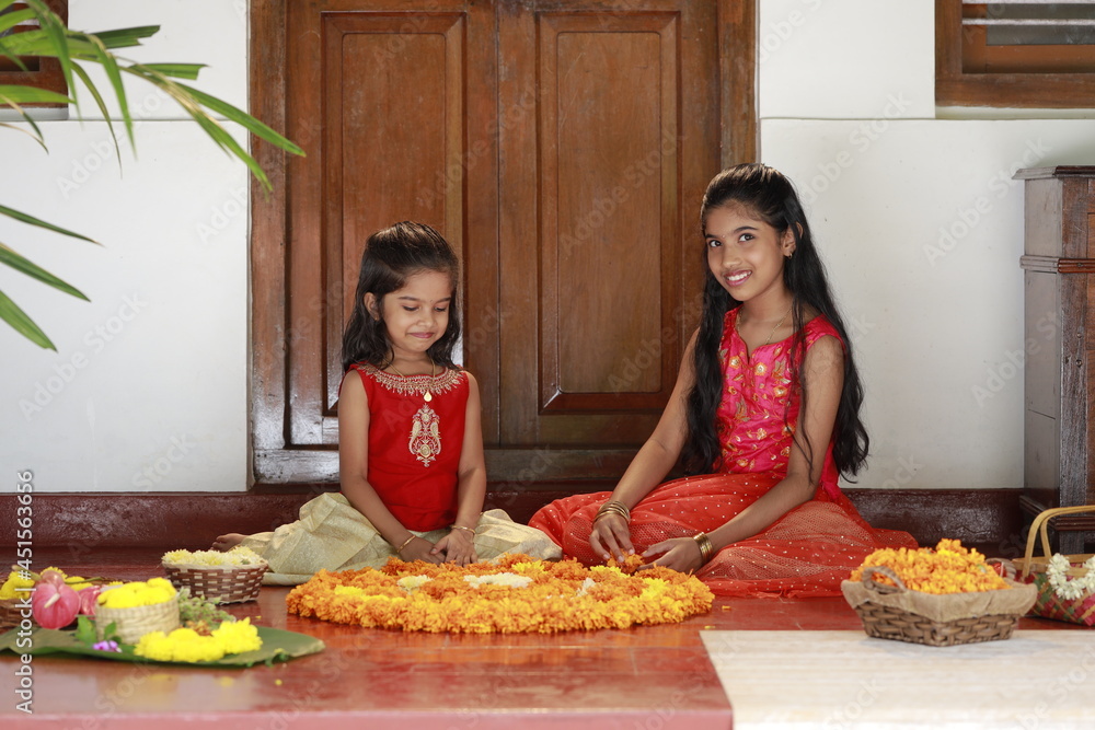 Onam pookalam making by kids Stock Photo | Adobe Stock