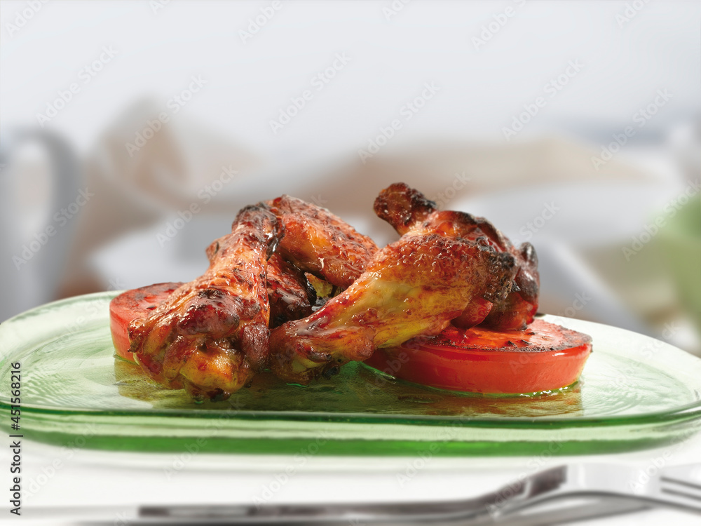 Pollo picante con tomates asados. Spicy chicken with roasted tomatoes ...