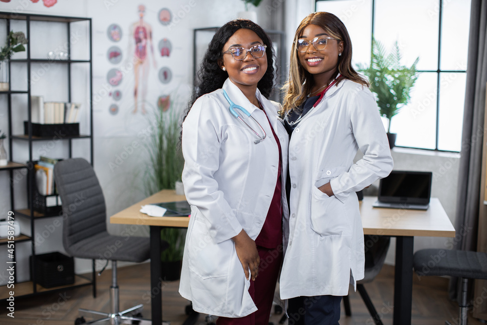 Portrait of two female African American doctors or nurses colleagues ...