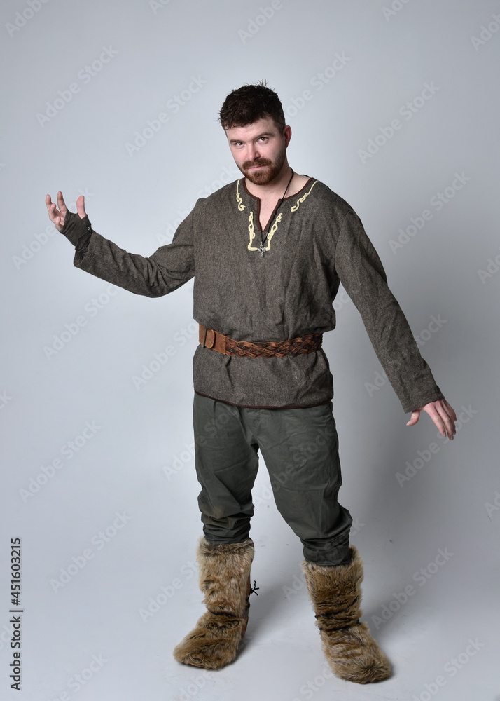 Full length portrait of young handsome man wearing medieval Celtic ...