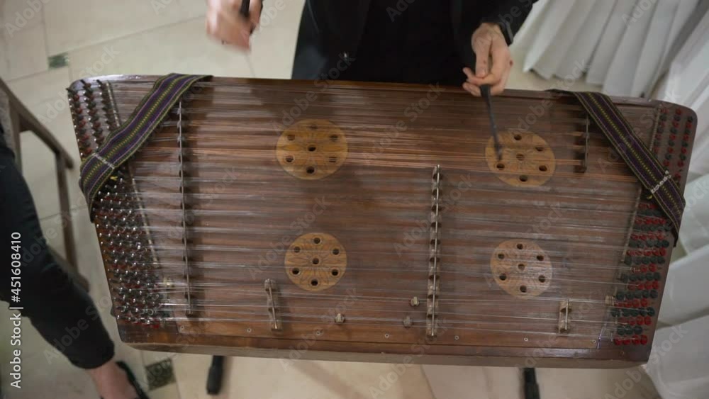 Stockvideo A professional musician plays a wooden musical instrument ...