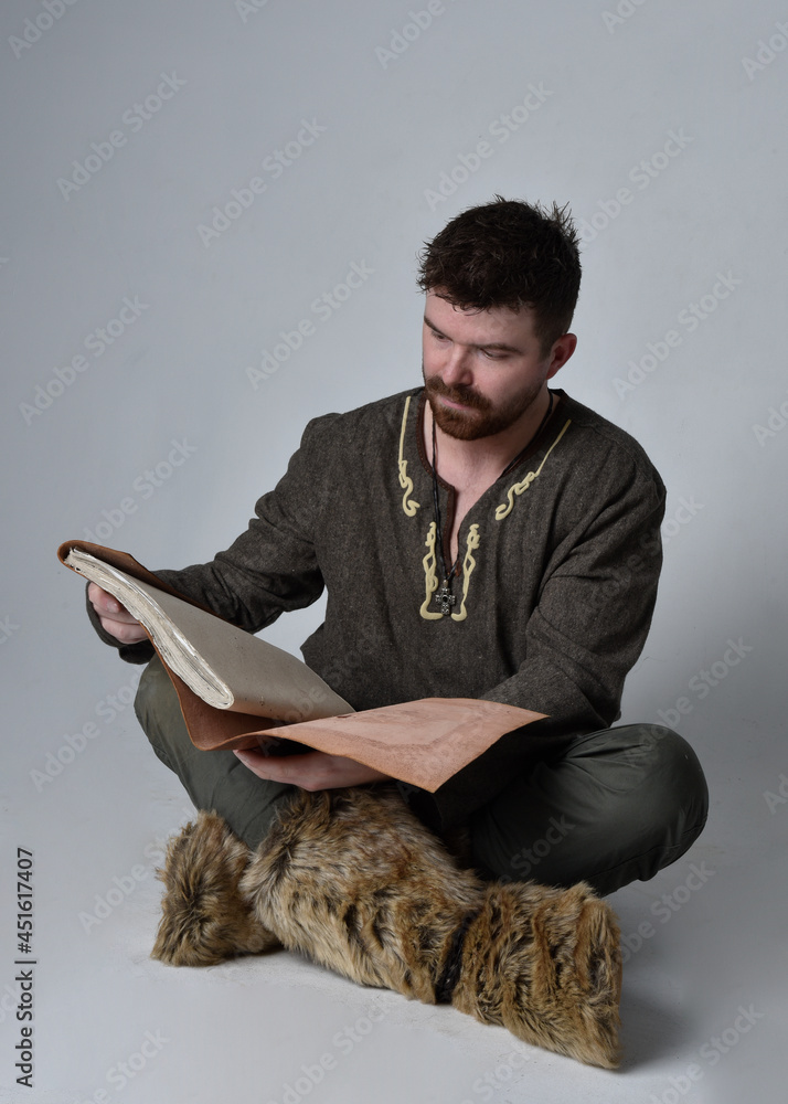 Full length portrait of young handsome man wearing medieval Celtic ...