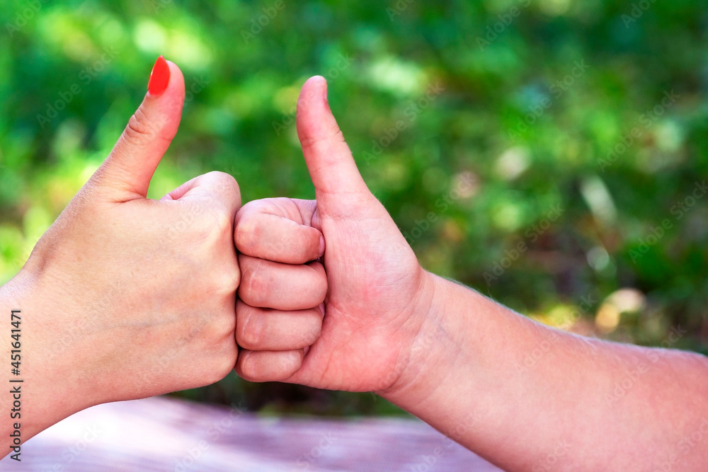 hand showing thumbs up sign. sign a finger in top. Good work ...