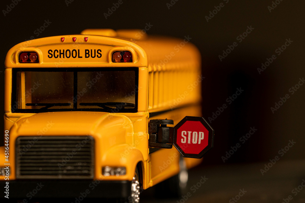 School bus model with stop sign. Do not pass the school bus. The stop ...