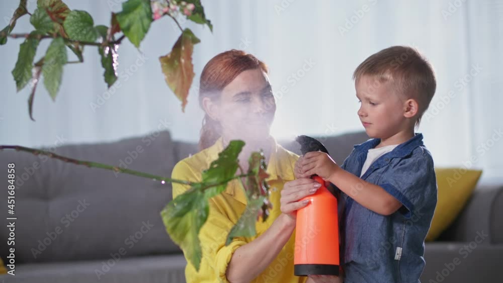 portrait of hardworking little male child with his cute female parent ...