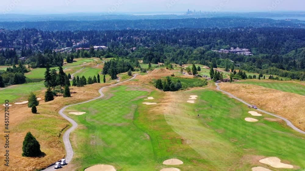 A drone showcases the iconic golf course perched above Seattle as ...