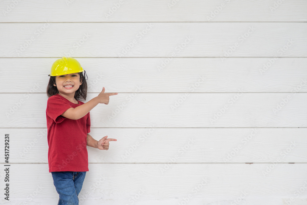 Asian girl children playing as an engineer helmet Stock Photo | Adobe Stock