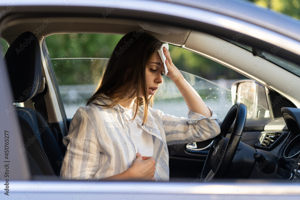 Girl driver being hot during heat wave in car, suffering from hot ...