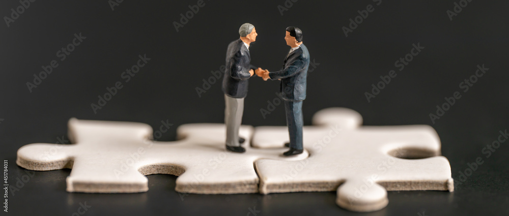 Miniature business man shake hand partner client customers on white ...