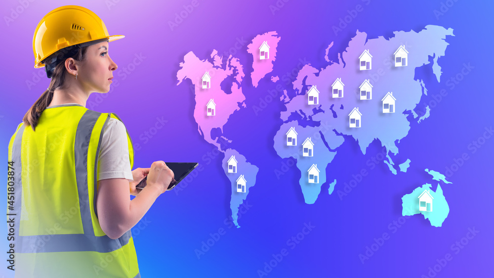 World map with house icons. Woman builder is holding a tablet. Concept ...