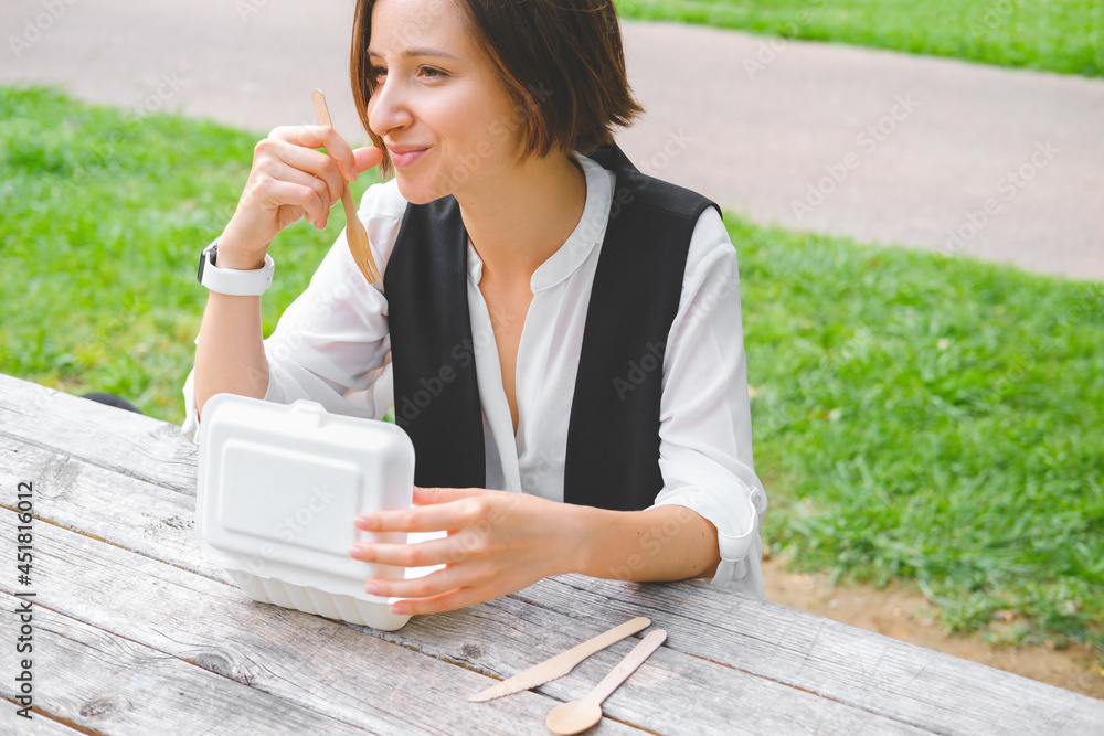 Young Caucasian Female With Thoughtful Expression Eating Take Away Food ...