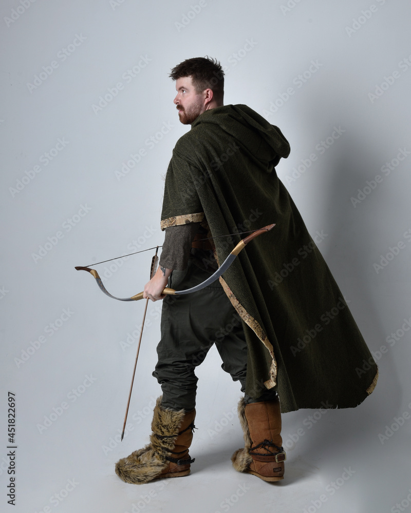 Full length portrait of young handsome man wearing medieval Celtic ...