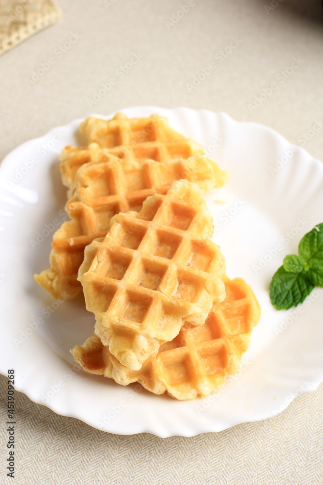 Plain Croffle Croissant Waffle on White Palte, Cream Table with Mint ...