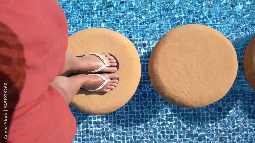 Top view of unrecognizable woman wearing sandals walking steps in a ...