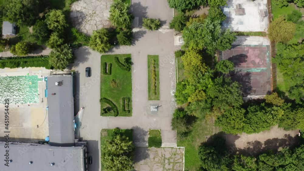Abandoned derelict unbuilt stadium construction ruins in city, aerial ...