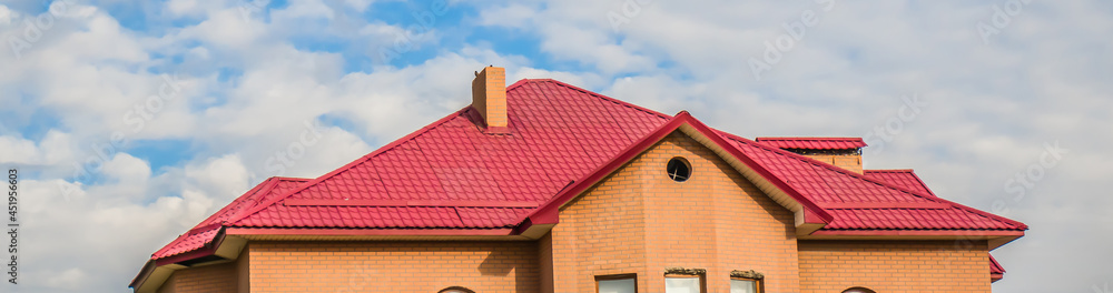 The roof is made of metal. Metal roofing sheets. Modern types of ...