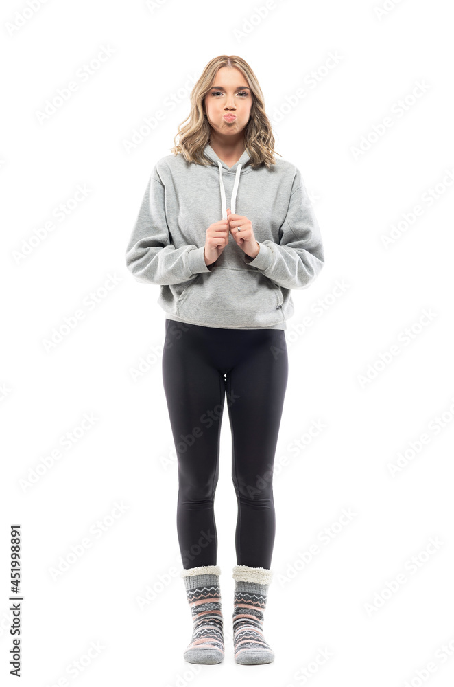 Cute funny young woman making holding breath grimace with puffed ...