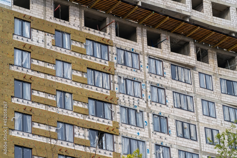 Installation of external wall thermal insulation with rock wool ...