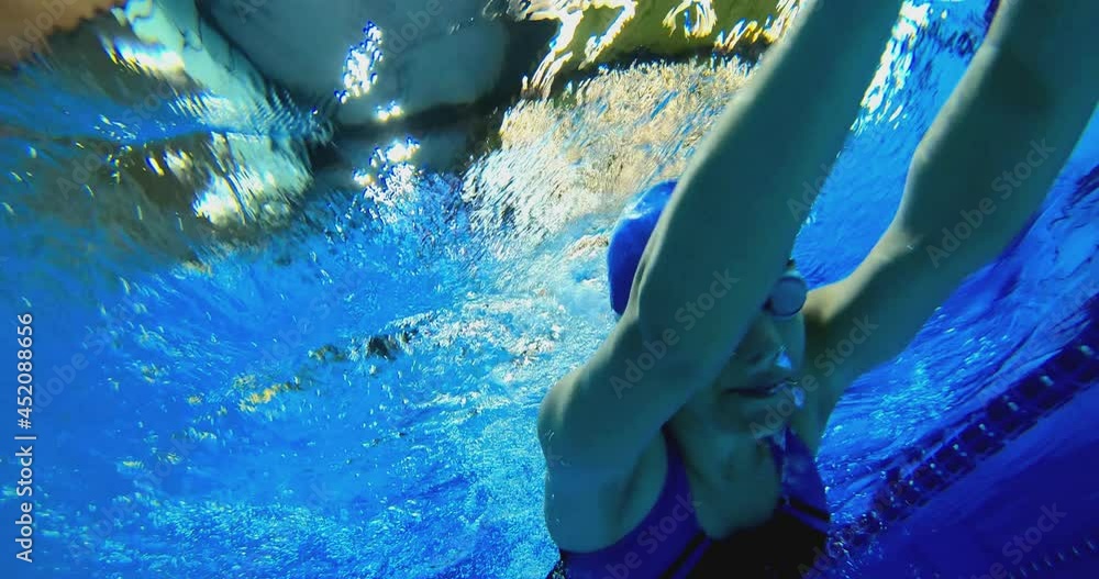 Under water view of professional female swimmer . Underwater footage of ...