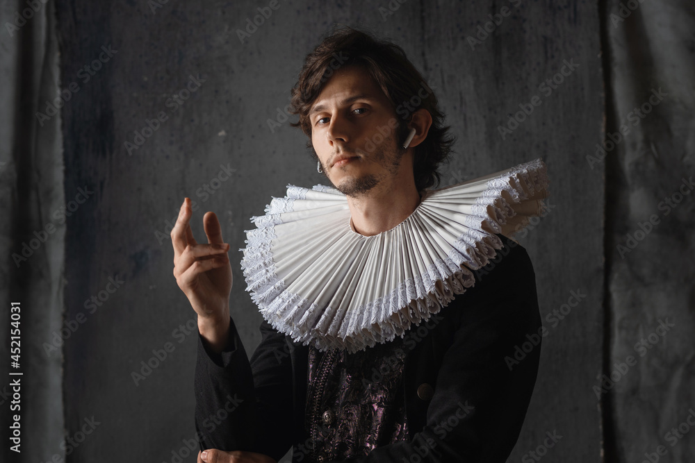 Classics are eternal, art is timeless. A young man in a medieval collar ...