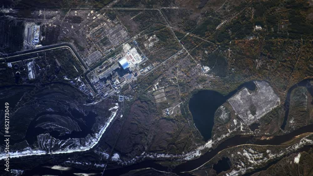 Chernobyl nuclear reactor area aerial satellite view dusk animation ...