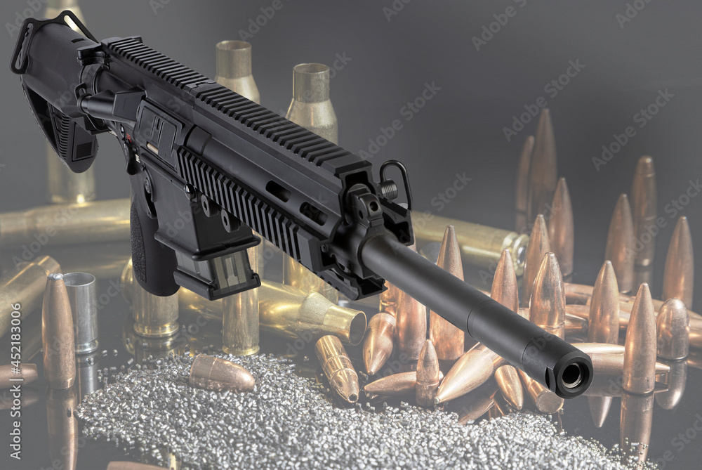 automatic army rifle with ammunition for shooting. black carbine and ...