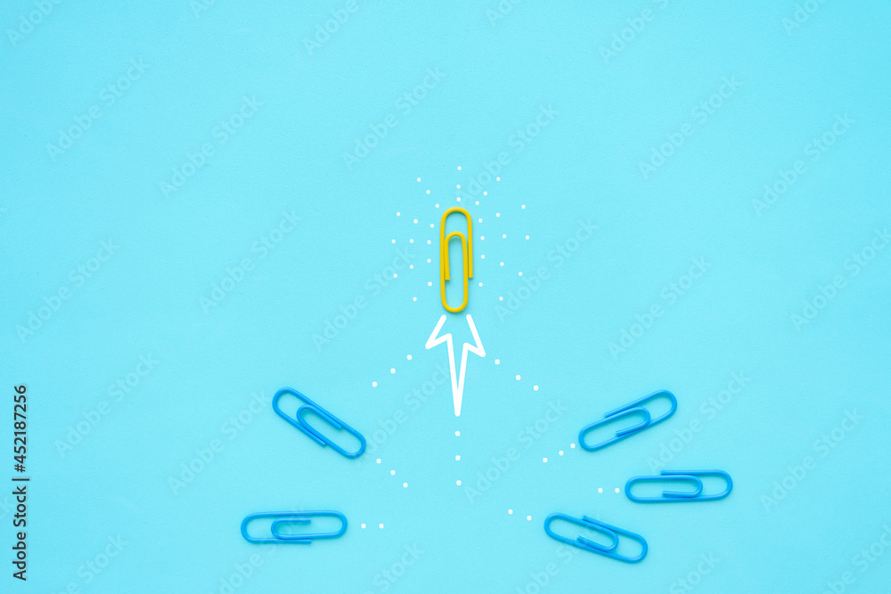 Paper clip yellow floating outstanding among paperclip paperclips on ...