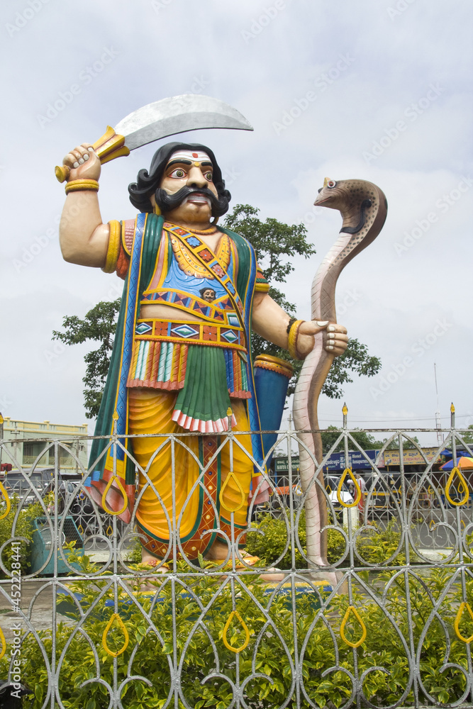 MYSURU, INDIA - Oct 21, 2012: Statue of demon Mahishasura with sword ...