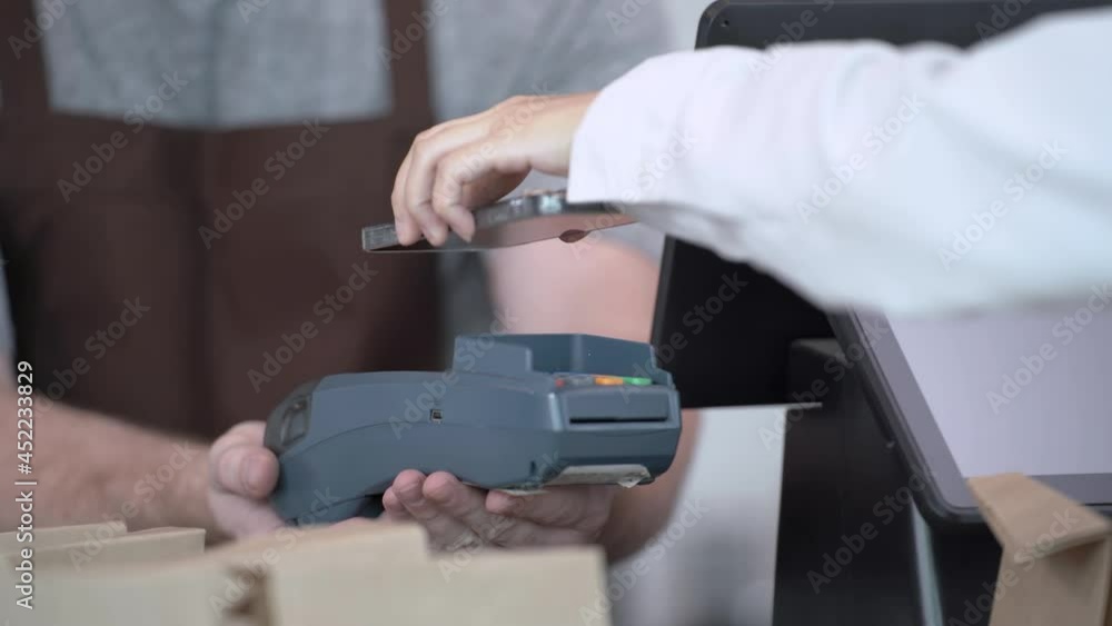 hand using payment machine to scanning from smartphone for cashless ...