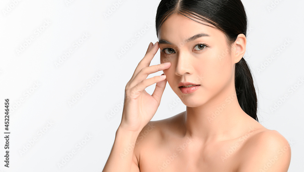 Beautiful young asian woman with clean fresh skin on white background ...