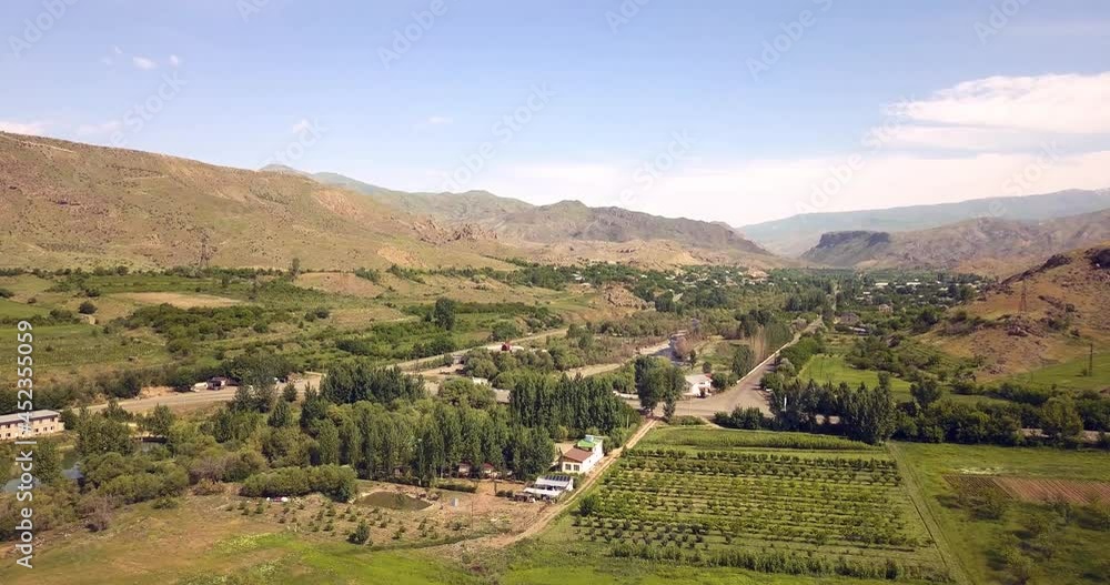 Aerial view of a small rural farmland in Areni region of Armenia. Along ...