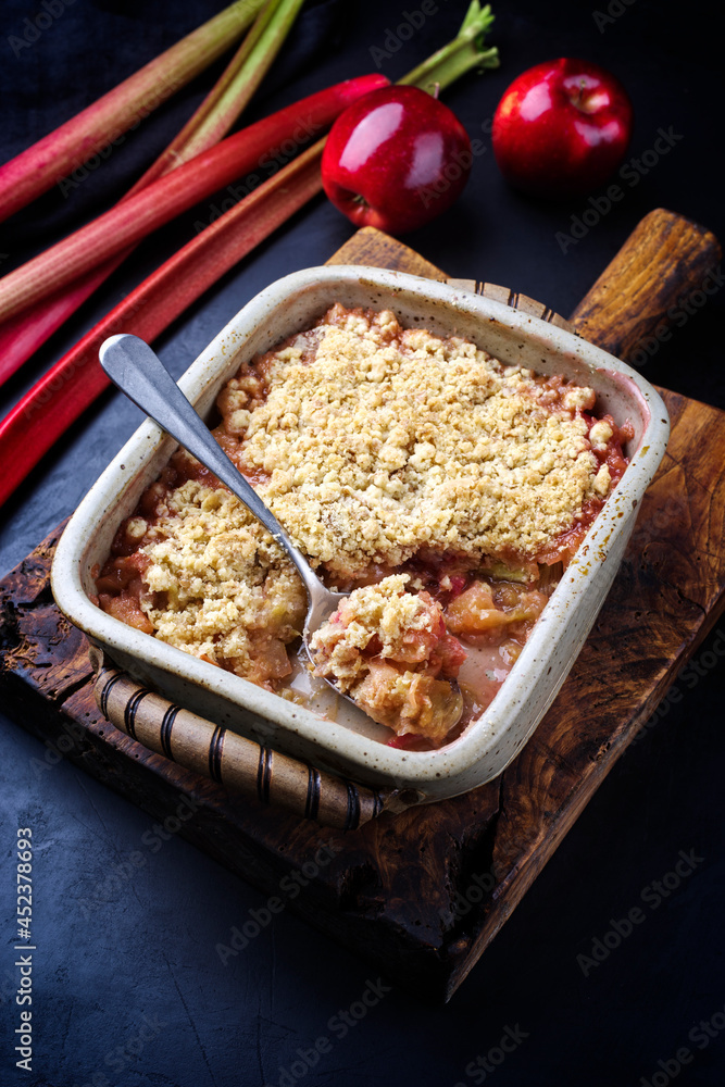 Traditional English crumble cake with rhubarb and apple with backed ...
