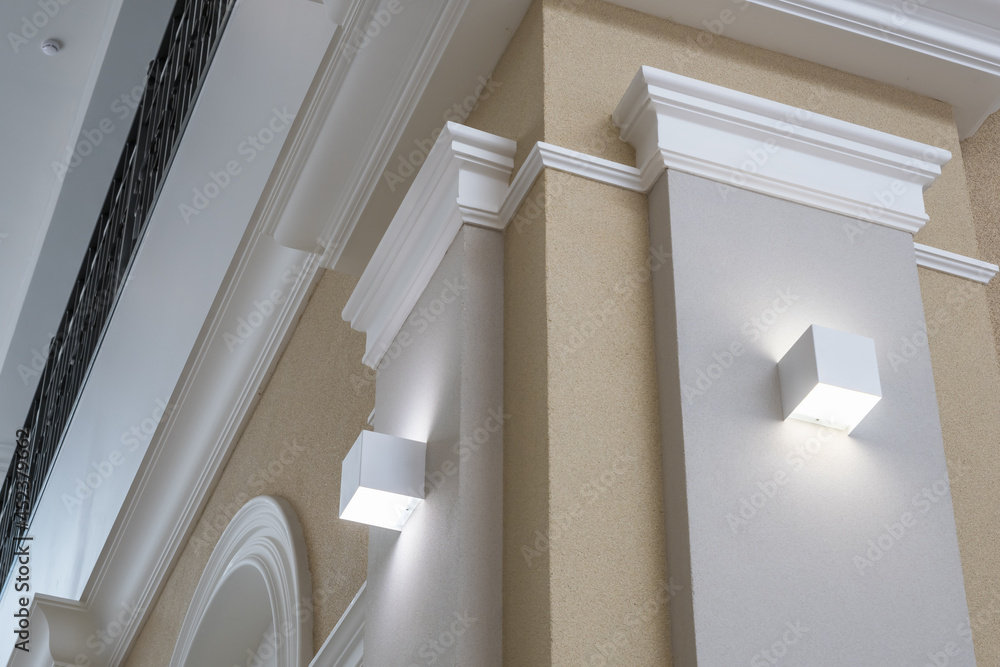 Detail of corner ceiling with intricate crown molding on column with ...