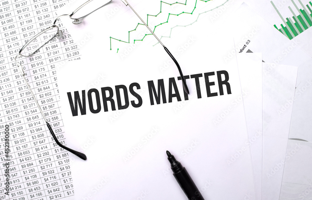 words matter . Conceptual background with chart ,papers, pen and ...