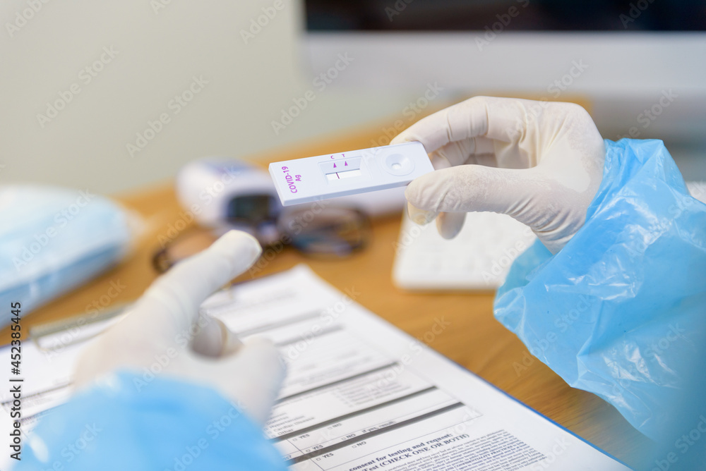 Hand of doctor or nurses holding rapid antigen test kit of Patient for ...