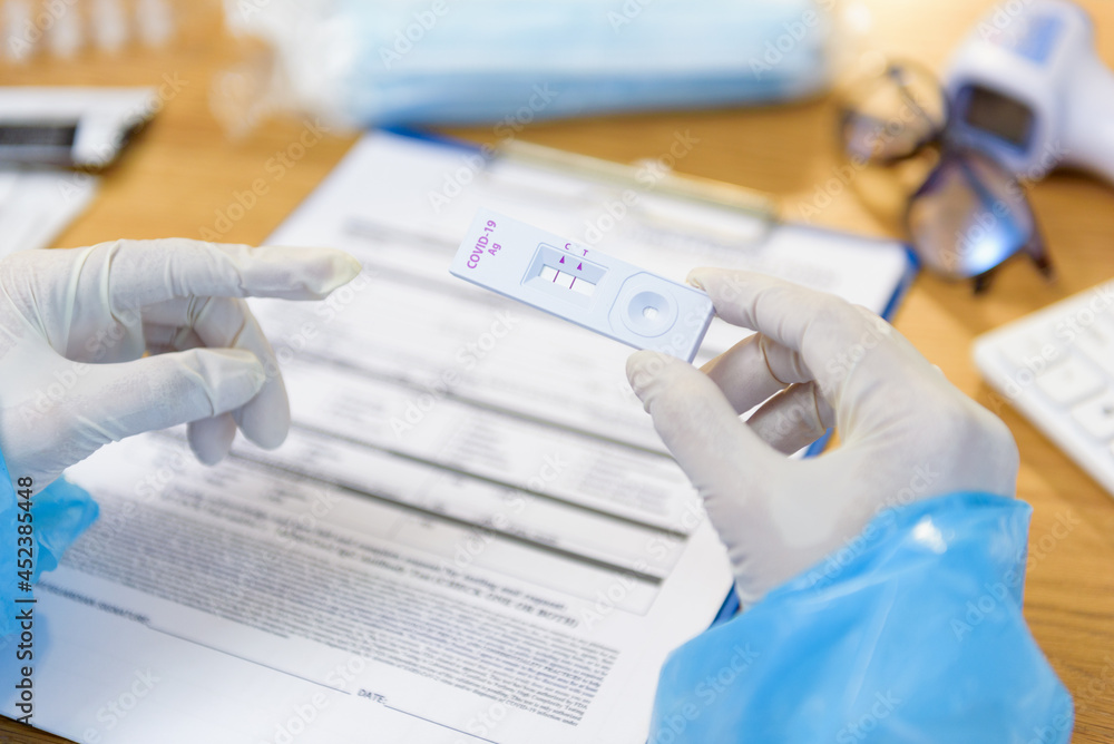Hand of doctor or nurses holding rapid antigen test kit of Patient for ...